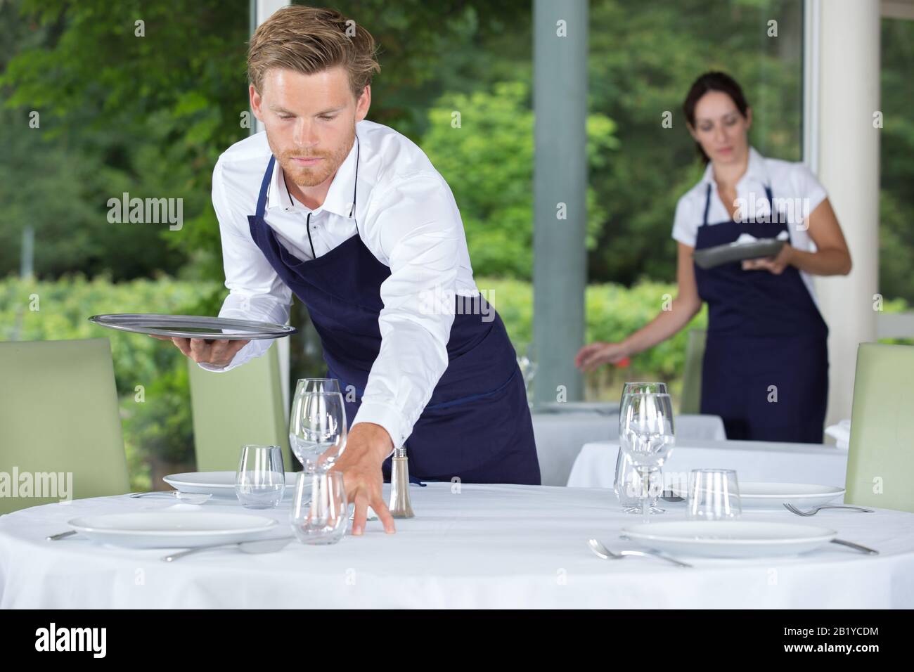 Waitress laying the table hi-res stock photography and images - Alamy