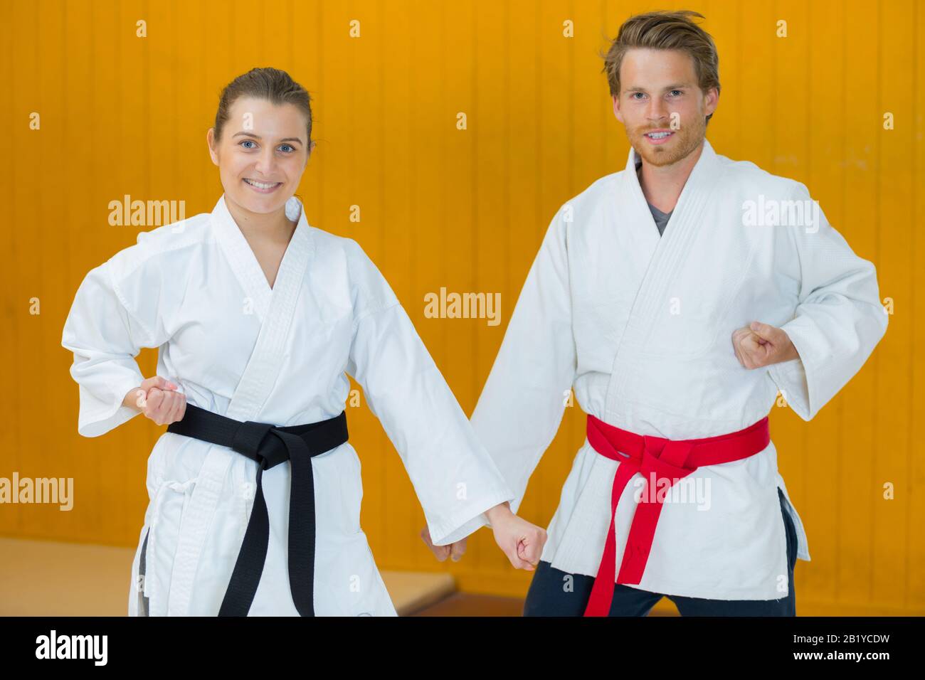 karate couple wearing kimonos standing together Stock Photo - Alamy