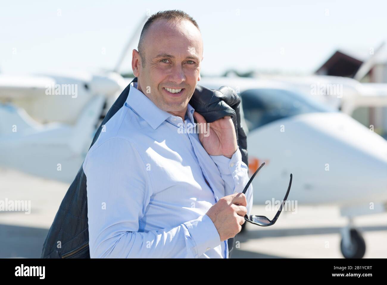 handsome pilot in aviation looking at camera Stock Photo - Alamy