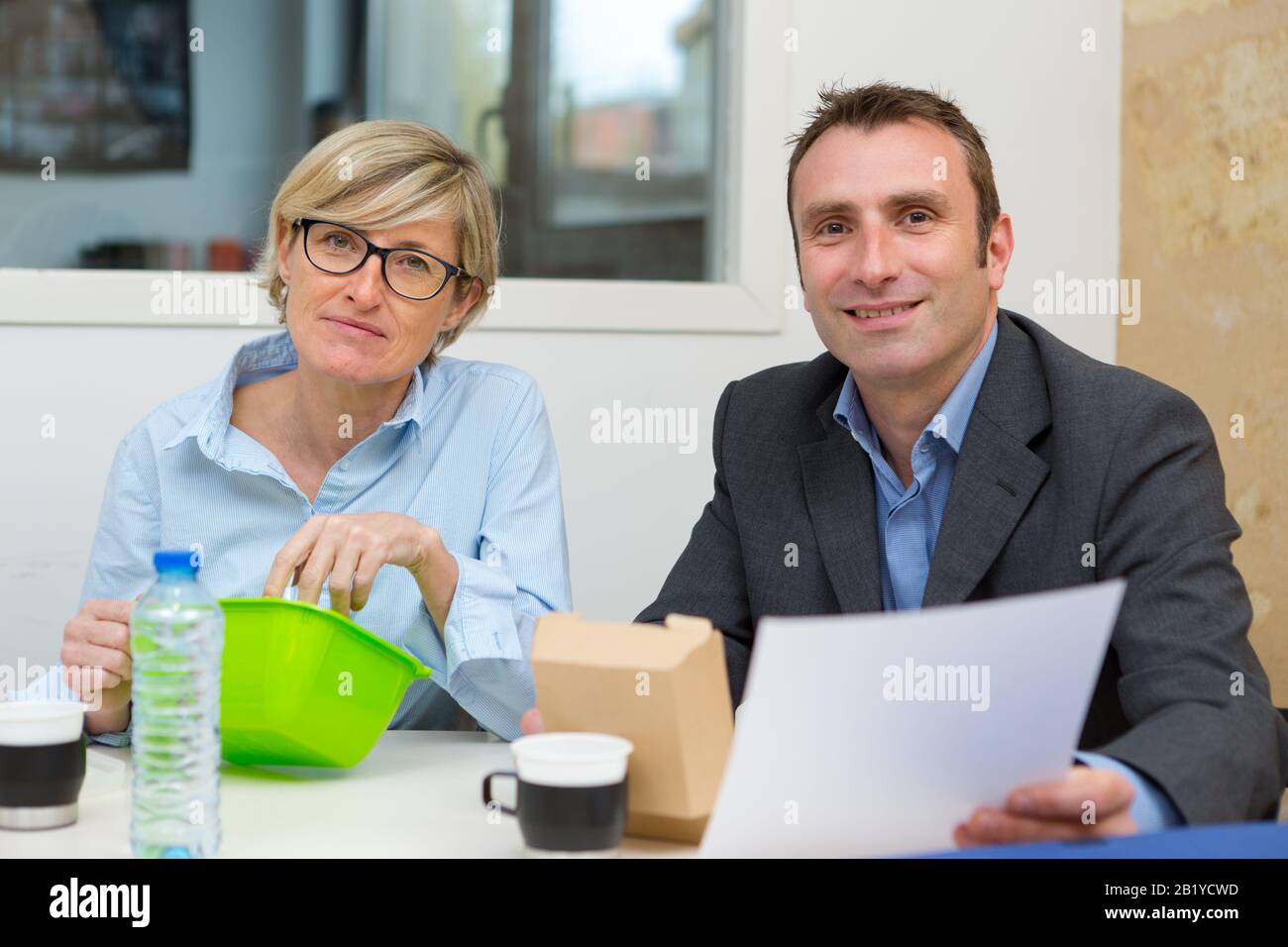 business colleagues dining at work Stock Photo - Alamy