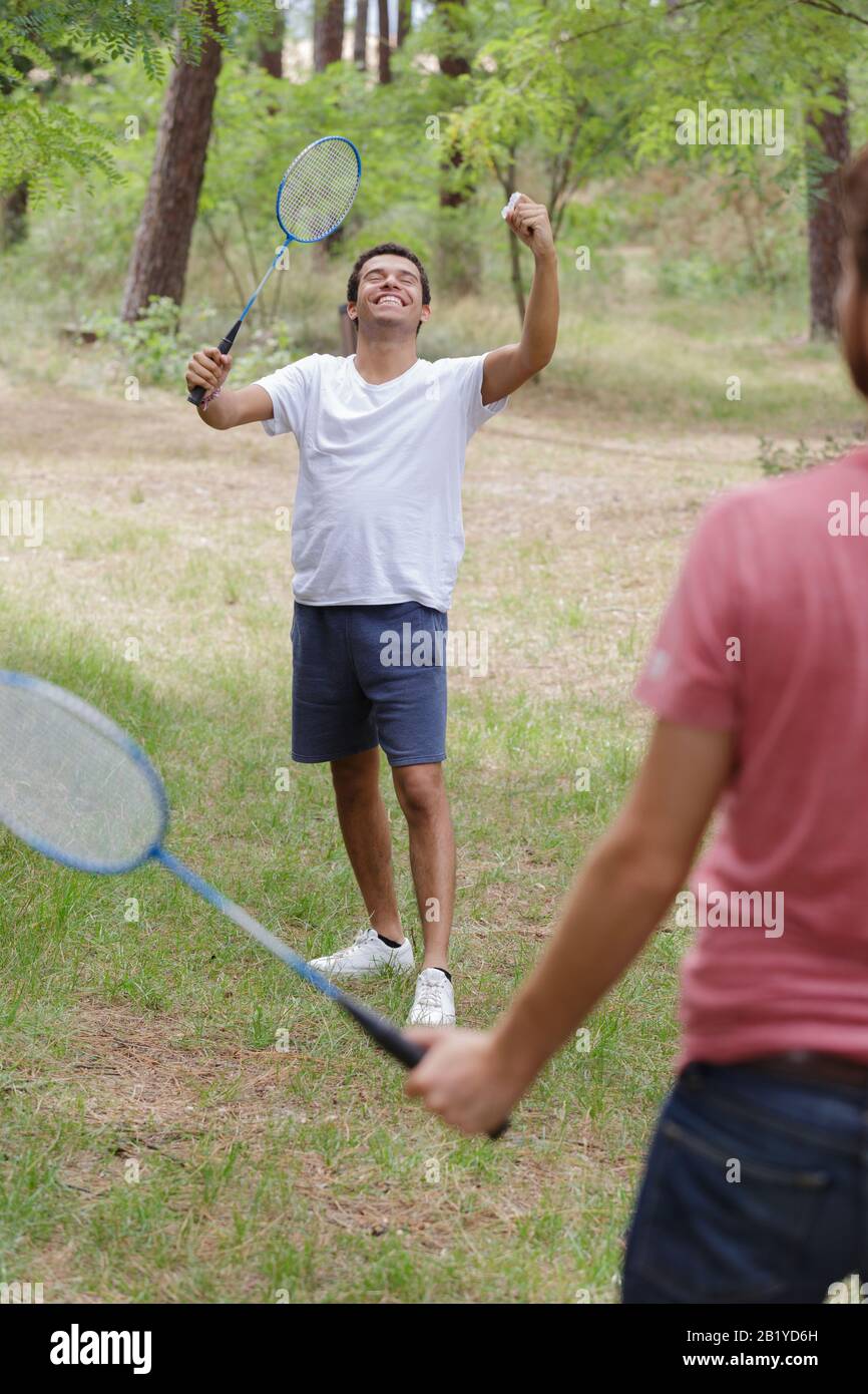 two friends playing outdoor badminton Stock Photo - Alamy