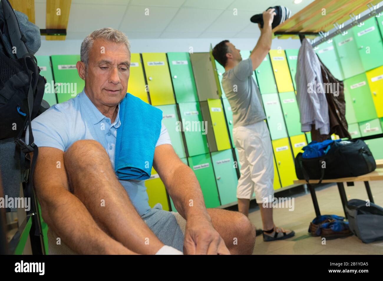 men in sports center changing room Stock Photo - Alamy