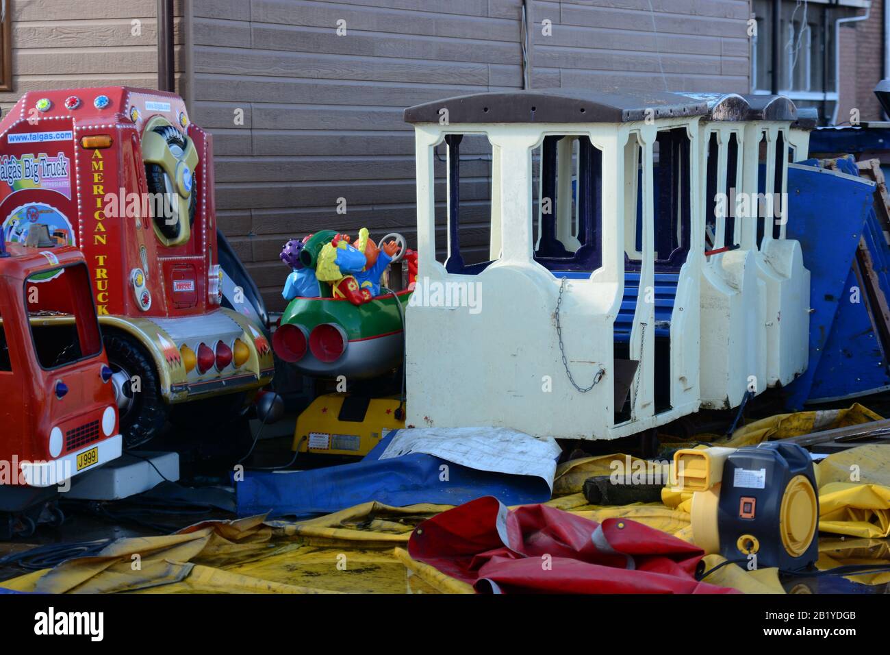 Amusement park funfair rides and vintage slot machines with vibrant ...