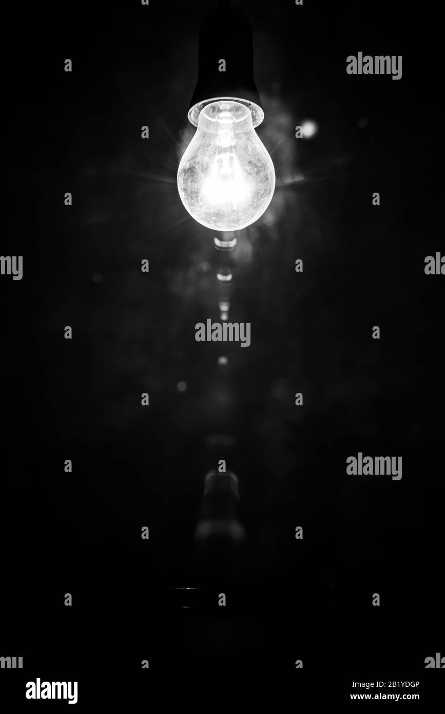 Electric lighting bulb on the dark background Stock Photo - Alamy