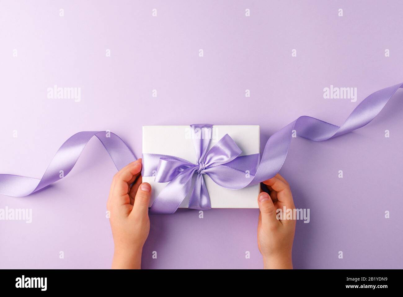 Lilac gift box present hi-res stock photography and images - Alamy