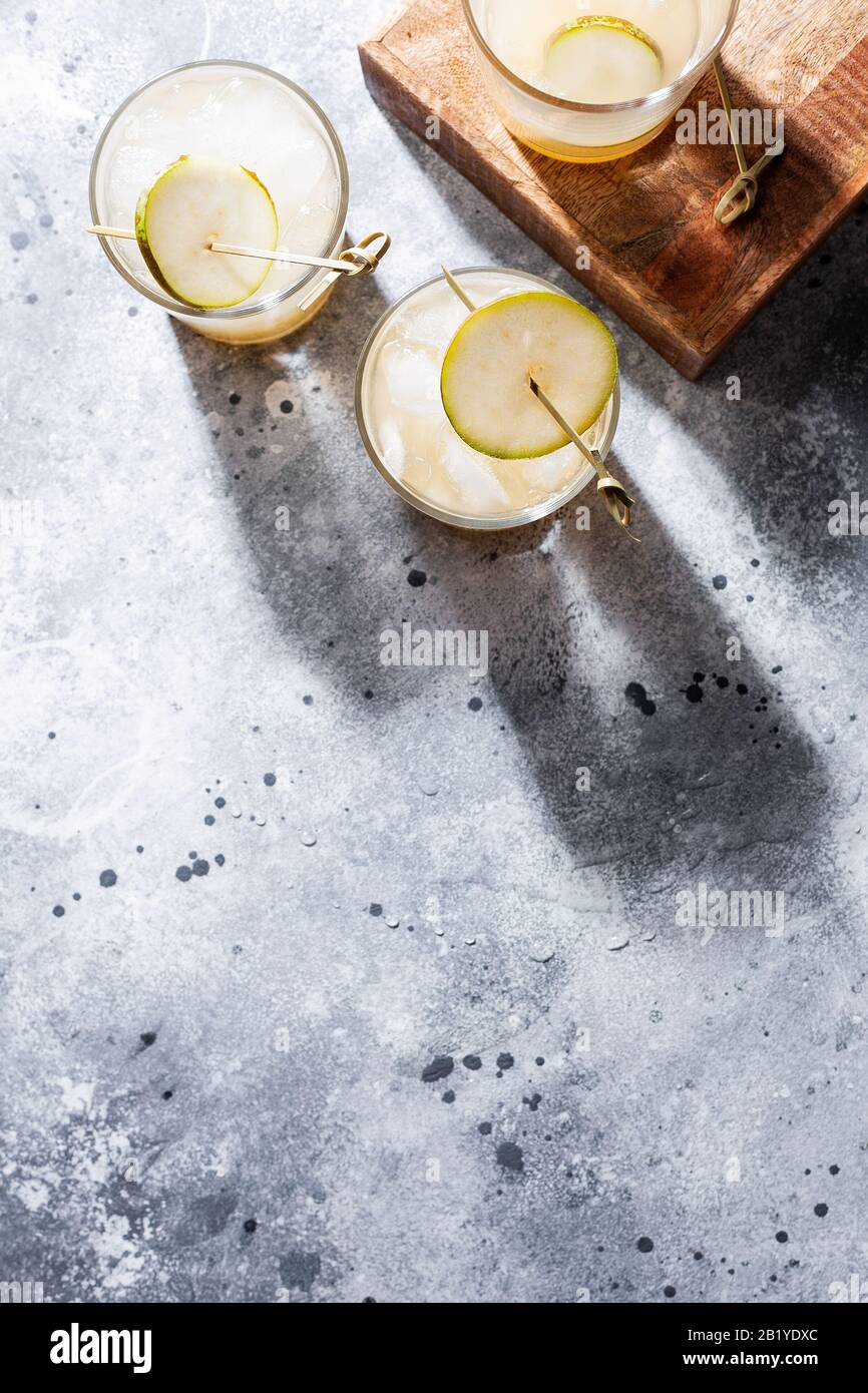 A short glass of refreshing pear soda water mocktail or cocktail on ...