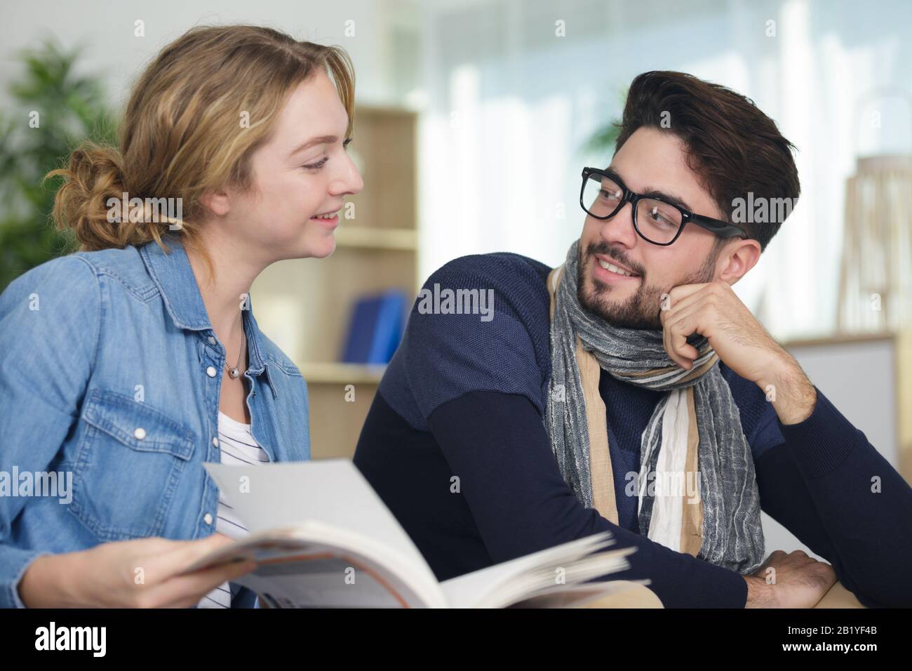 Young couple looking at paperwork hi-res stock photography and images ...