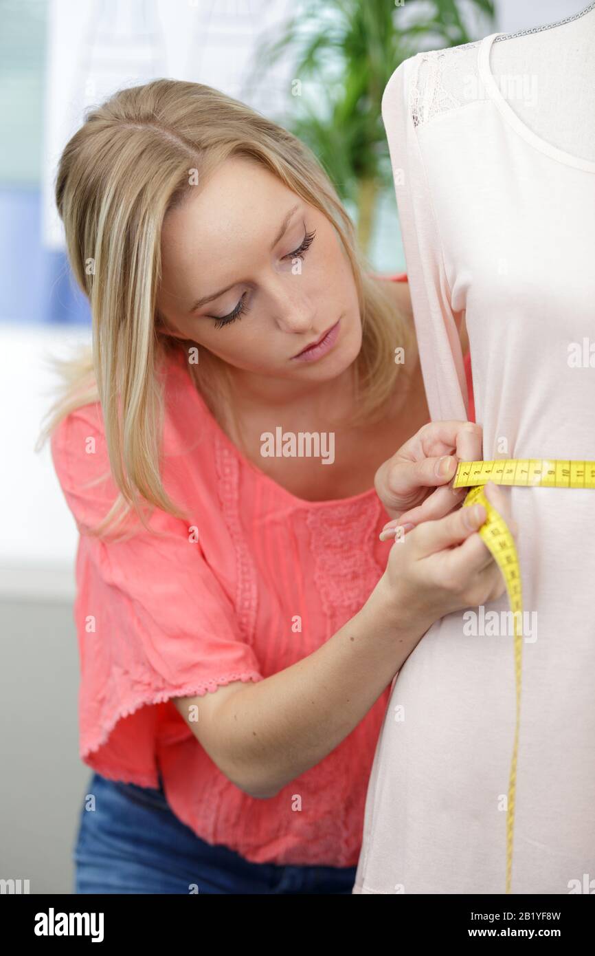 young professional female tailor using tape tool measure Stock Photo ...