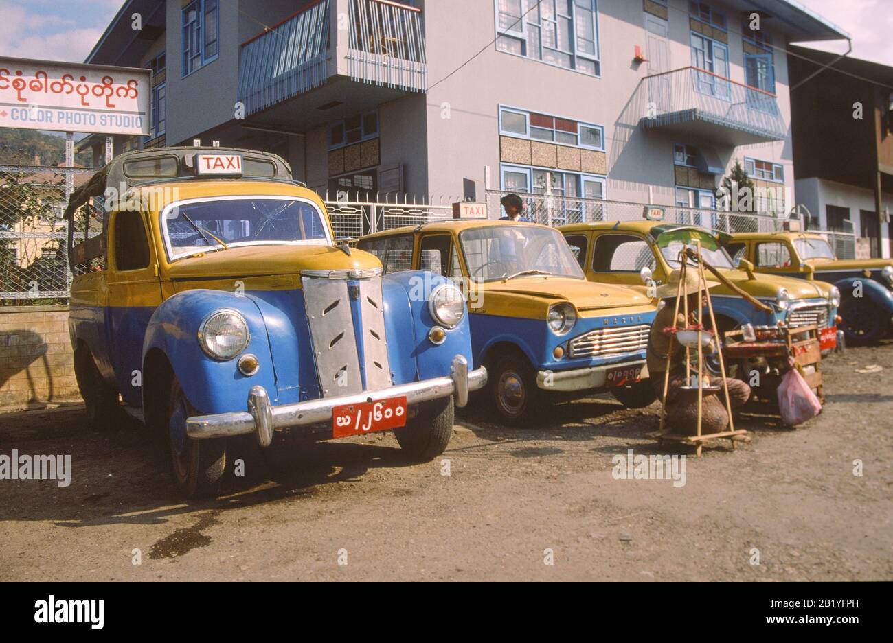 Old (1940-1950) Ford prefect Taxi sitting along with other old taxi's ...
