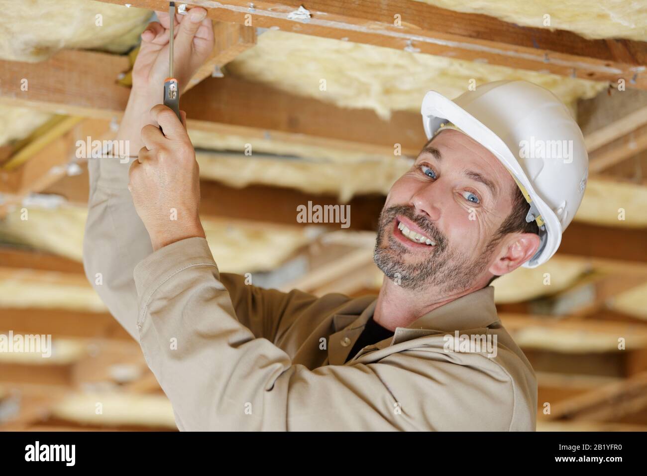 Man screws board screwdriver hi-res stock photography and images - Alamy