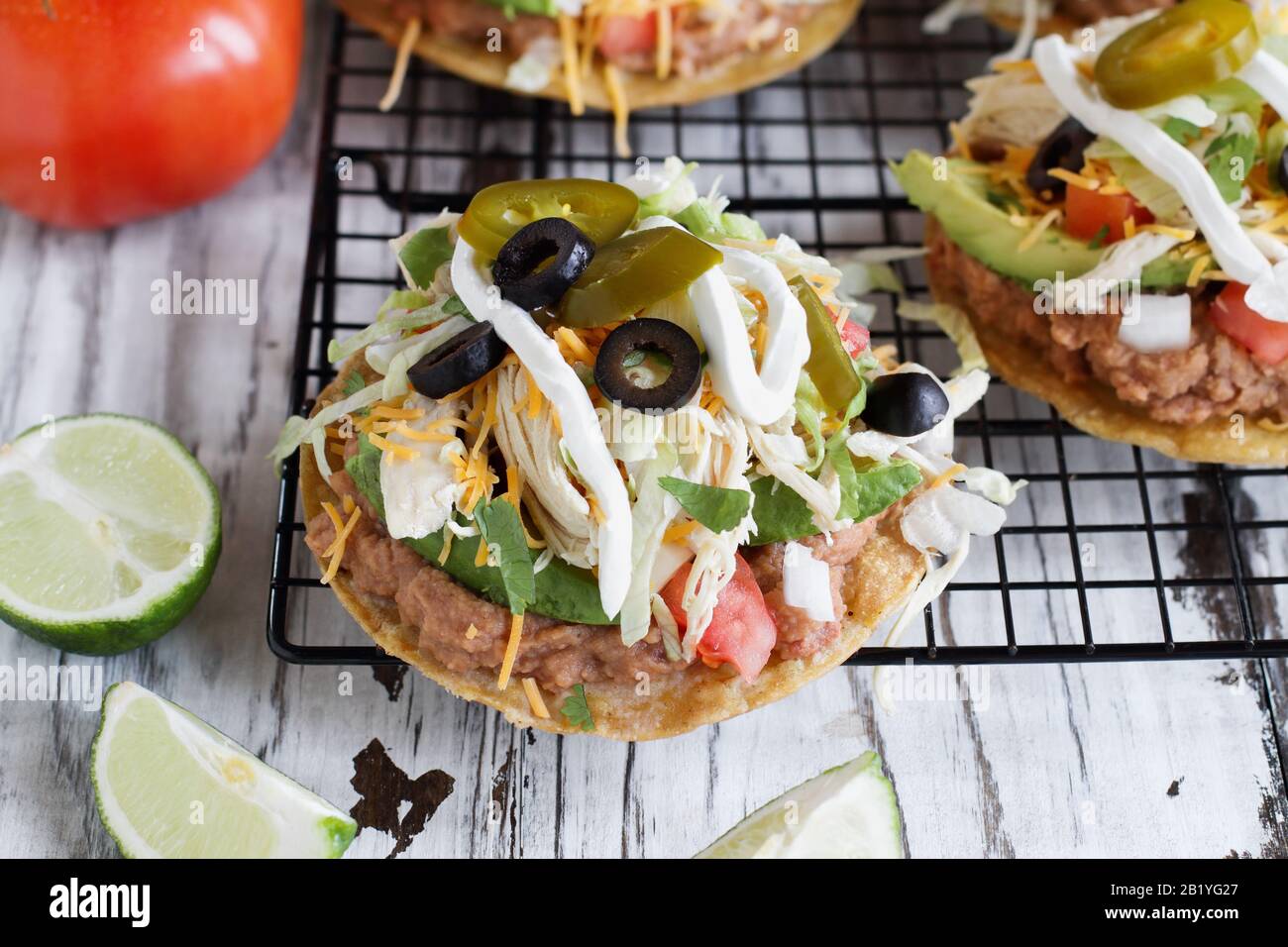 Homemade chicken tostadas with refried pinto beans, fresh cilantro ...