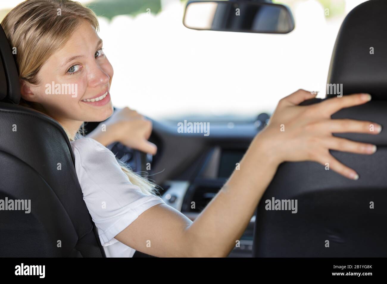 a happy female taxi driver Stock Photo - Alamy