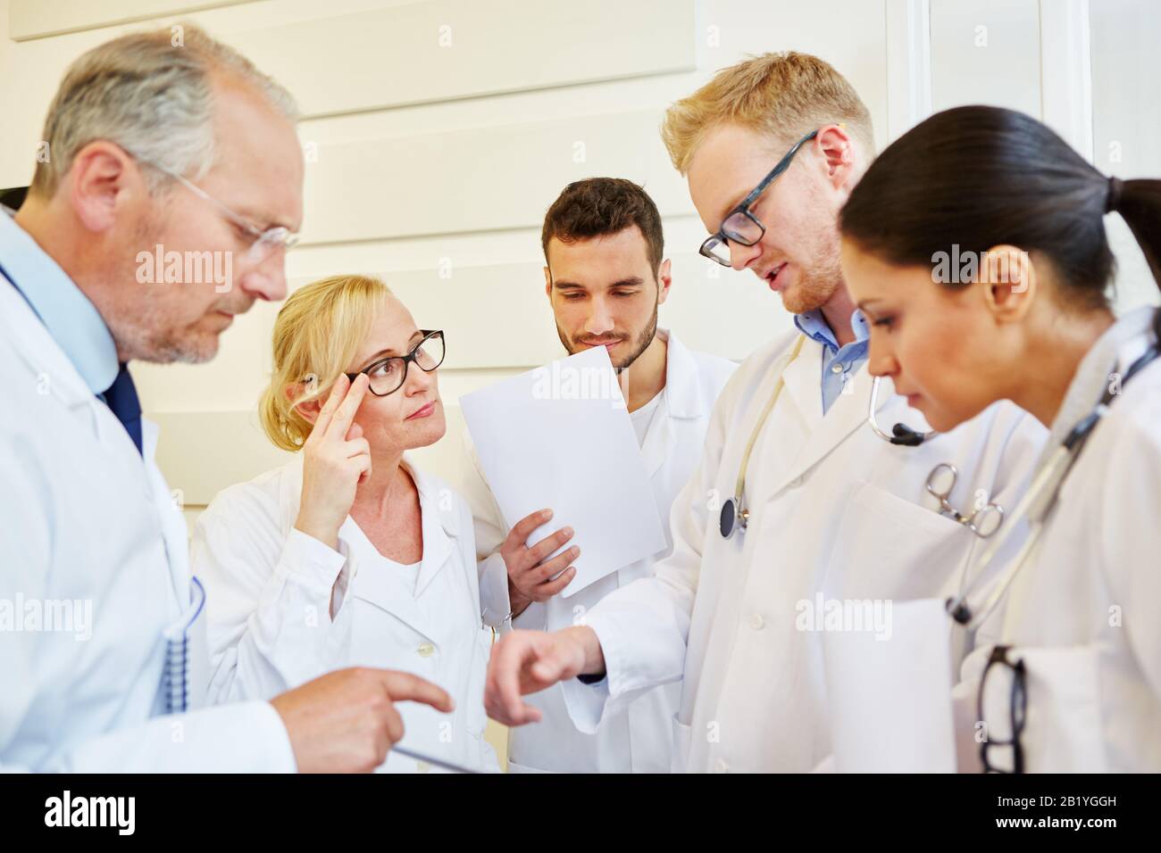 Doctors team at a hospital meeting Stock Photo - Alamy