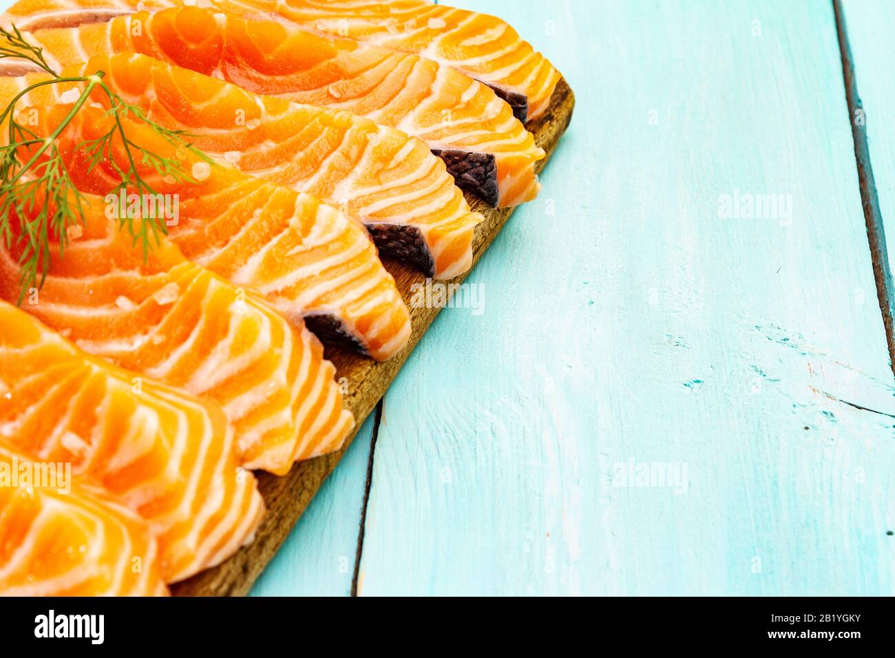 Slices of fresh salmon fish. Raw ingredient for cooking healthy seafood ...