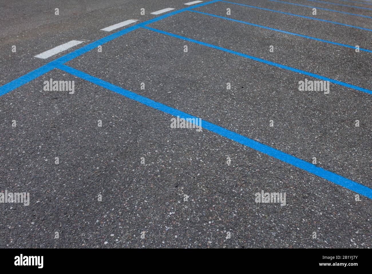 car park area with blue line for ticketing Stock Photo - Alamy