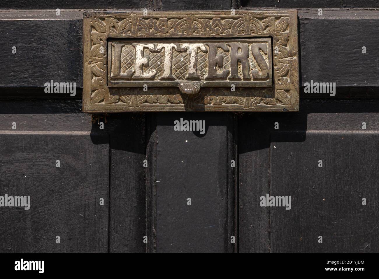 Old letterbox in the door, traditional way of delivering letters to the ...
