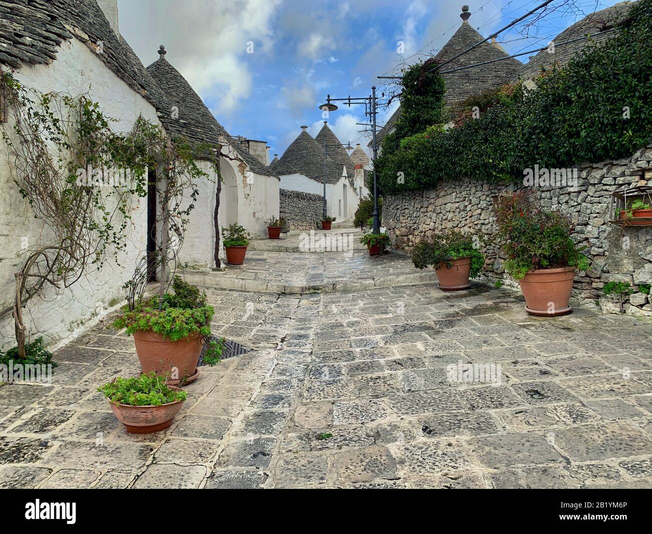 Walking streets of trulli town Alberobello, Italy Stock Photo - Alamy