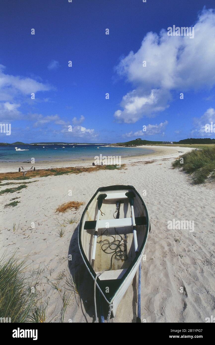 A moored rowing boat on the sandy beach at Green Porth, Old Grimsby ...