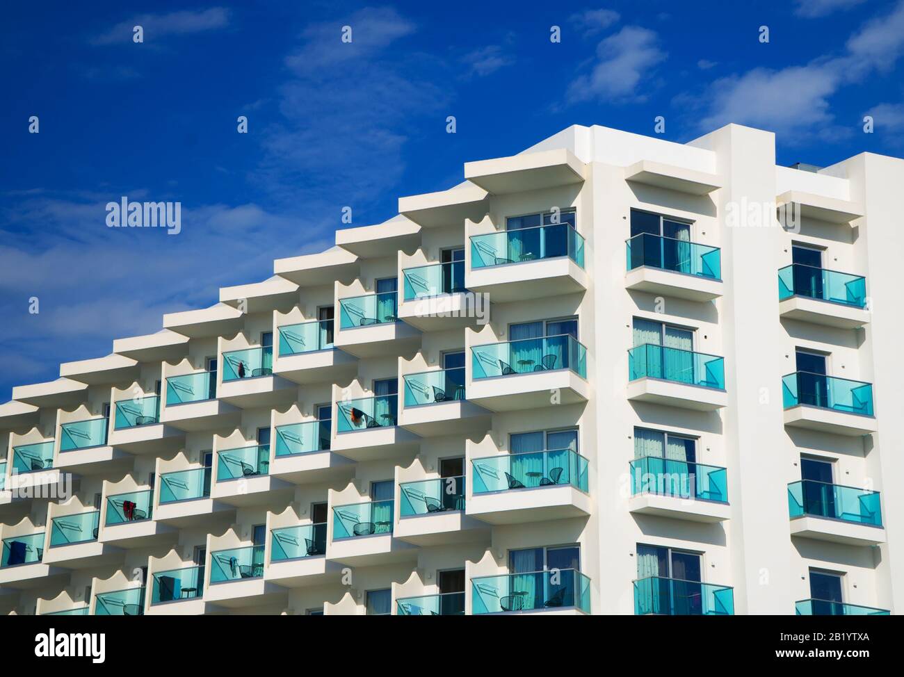 Portrait of hotel or apartment building with balconies Stock Photo - Alamy