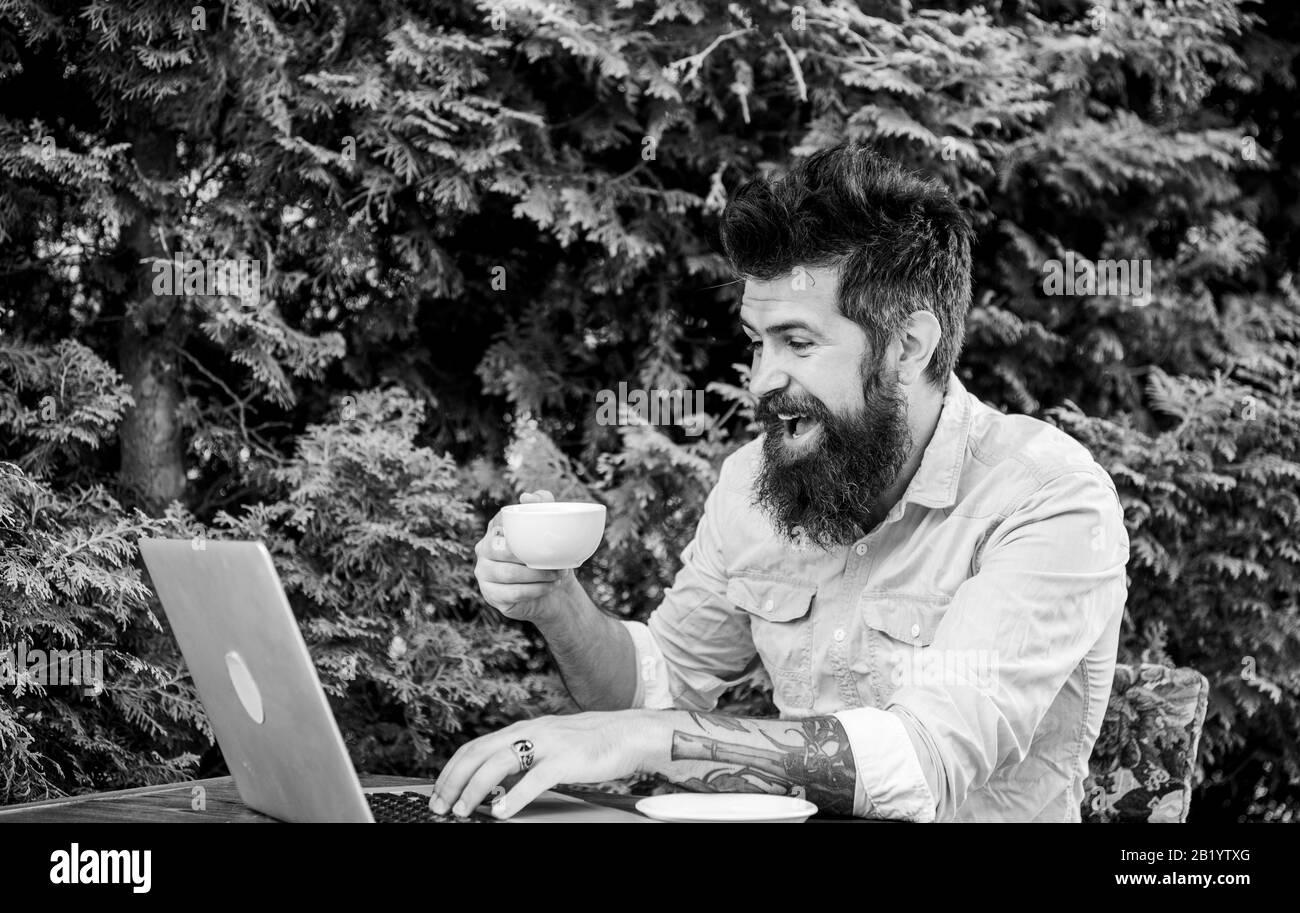 Businessman using laptop outdoor Black and White Stock Photos & Images ...