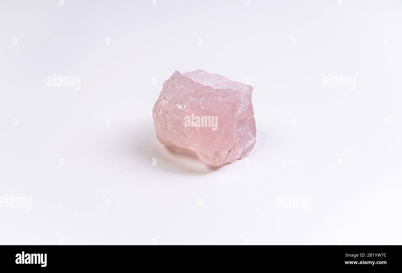 Pink rose quarz crystal isolated on white background Stock Photo - Alamy