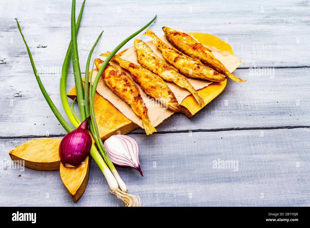 Fried smelt with fresh onions. Healthy seafood with the smell of ...