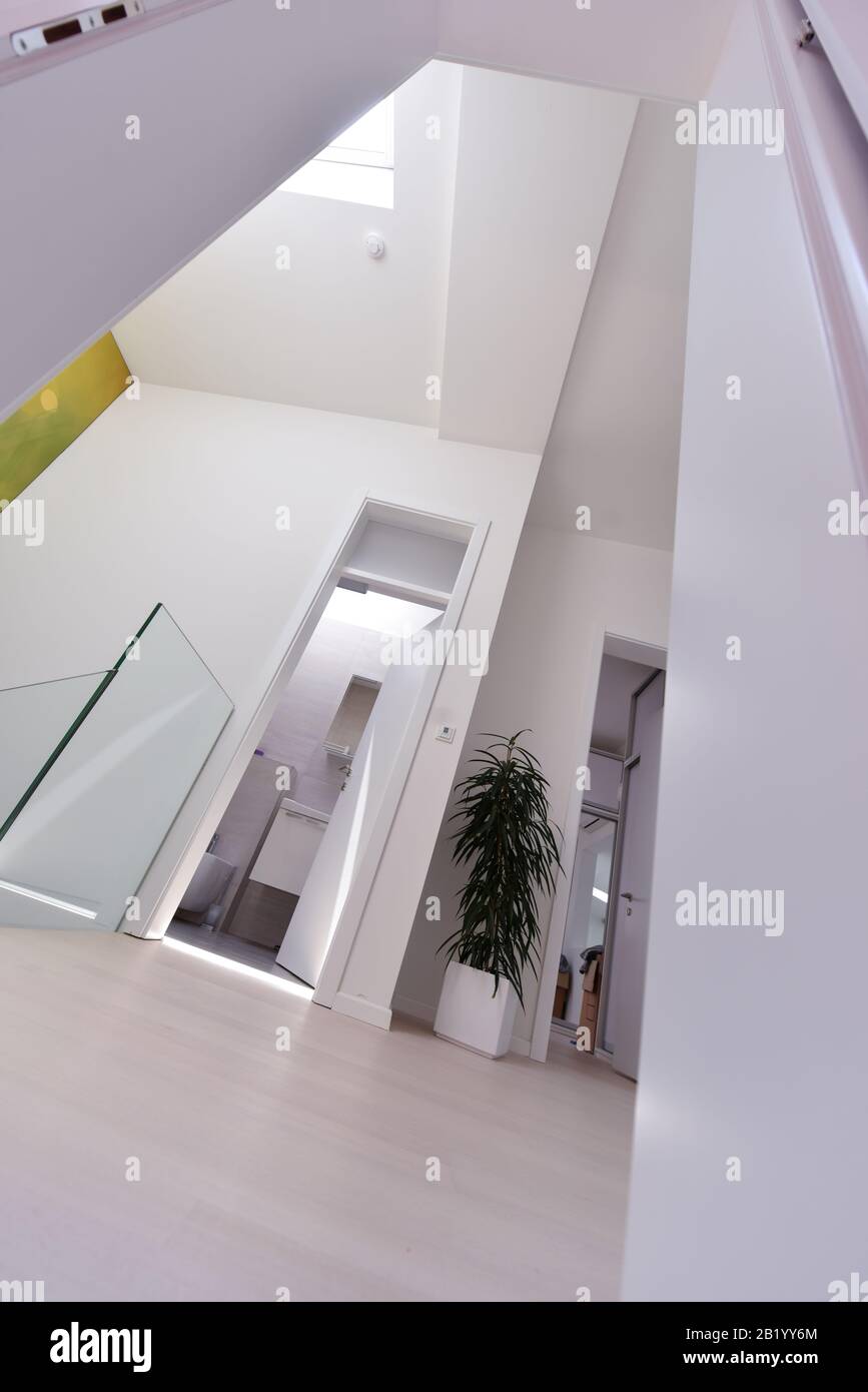 looking up on ceiling with halogen spots lamps and roof windows in ...