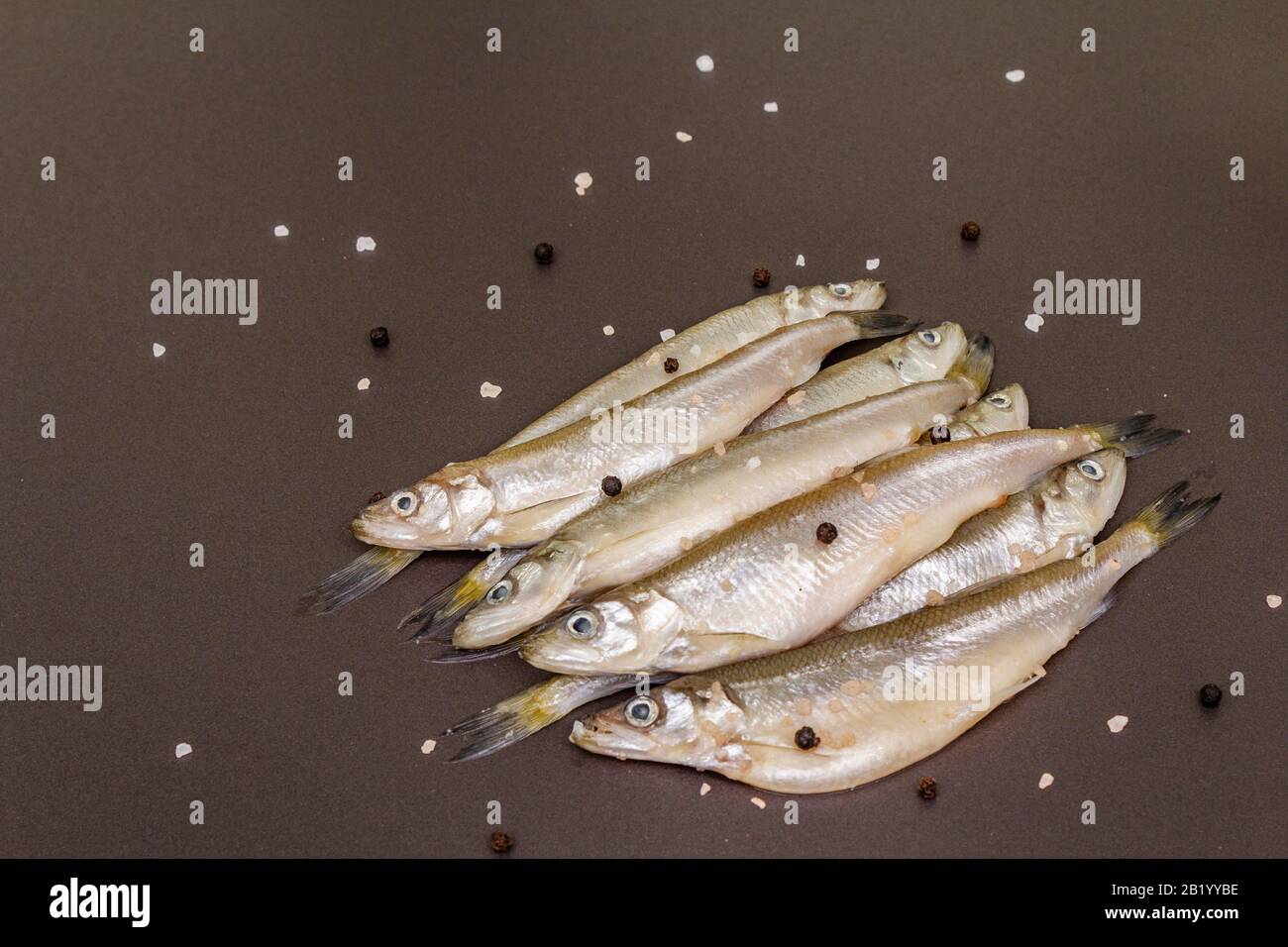Raw sea fish smelt, sardines, anchovies, capelin with the scent of ...
