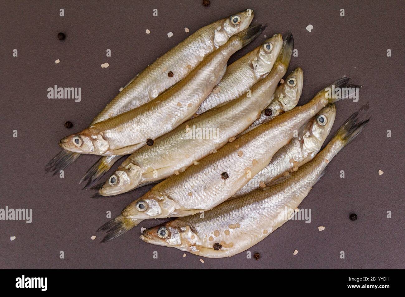 Raw sea fish smelt, sardines, anchovies, capelin with the scent of ...