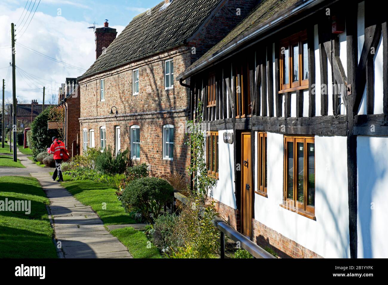 Postman in the village of Wheldrake, East Yorkshire, England UK Stock ...