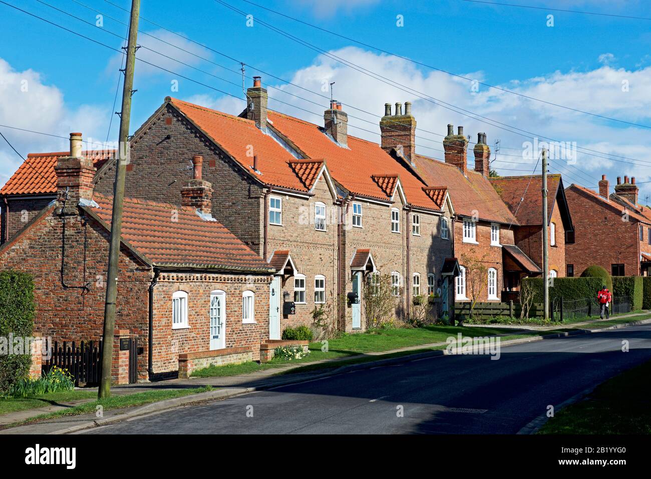 Postman in the village of Wheldrake, East Yorkshire, England UK Stock ...