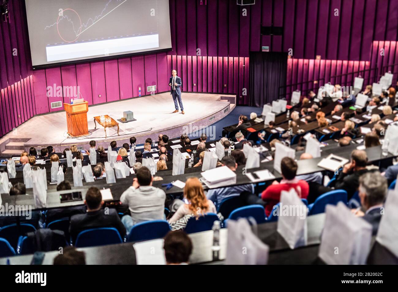 Speaker giving presentation on business conference event Stock Photo ...
