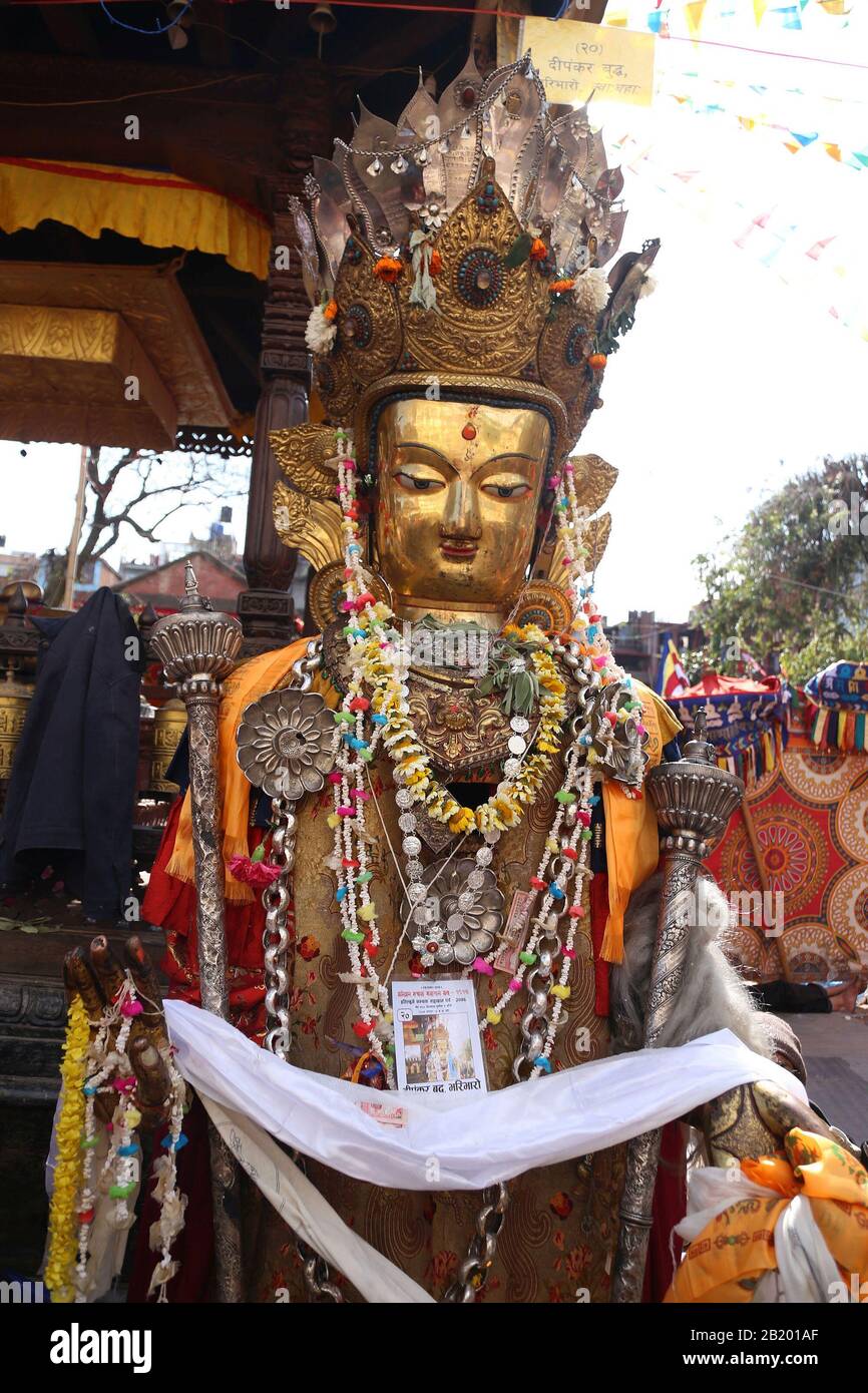 Lalitpur, Nepal. 27th Feb, 2020. Devotees offer prayers to Dipankar Buddha during Samyak Mahadan ...