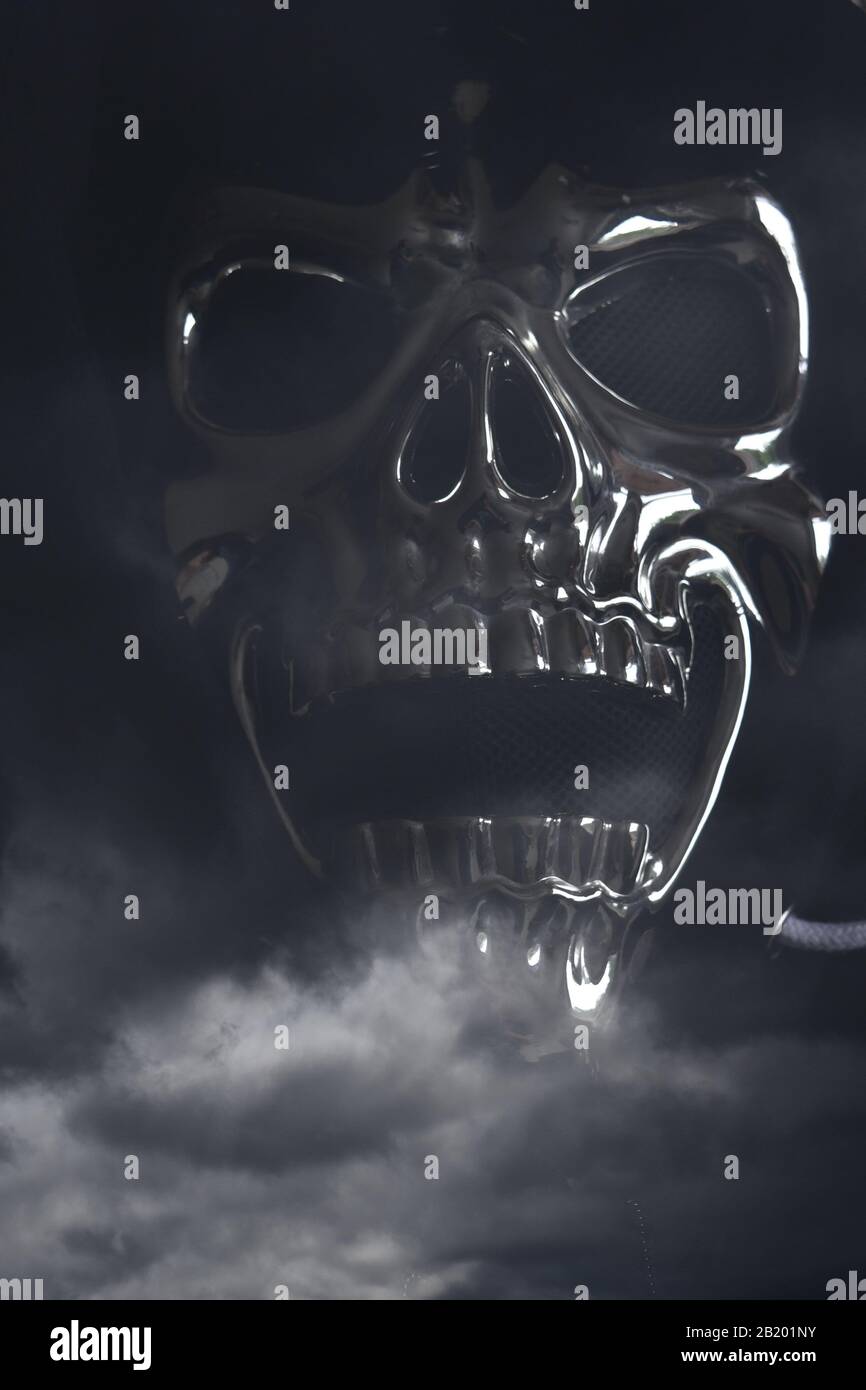 Death head skull mask double exposure against a cloudy sky Stock Photo ...