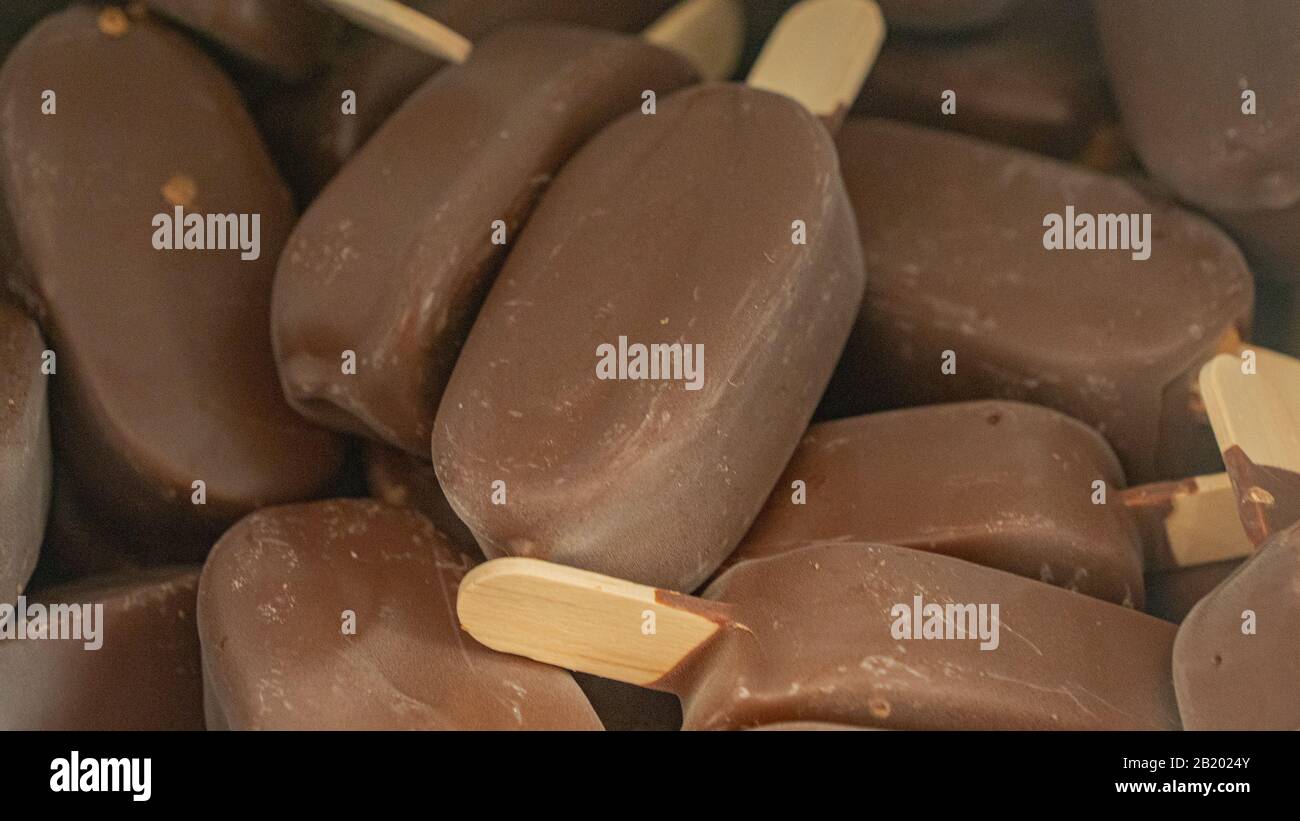 small mini chocolate ice creams with sticks Stock Photo - Alamy