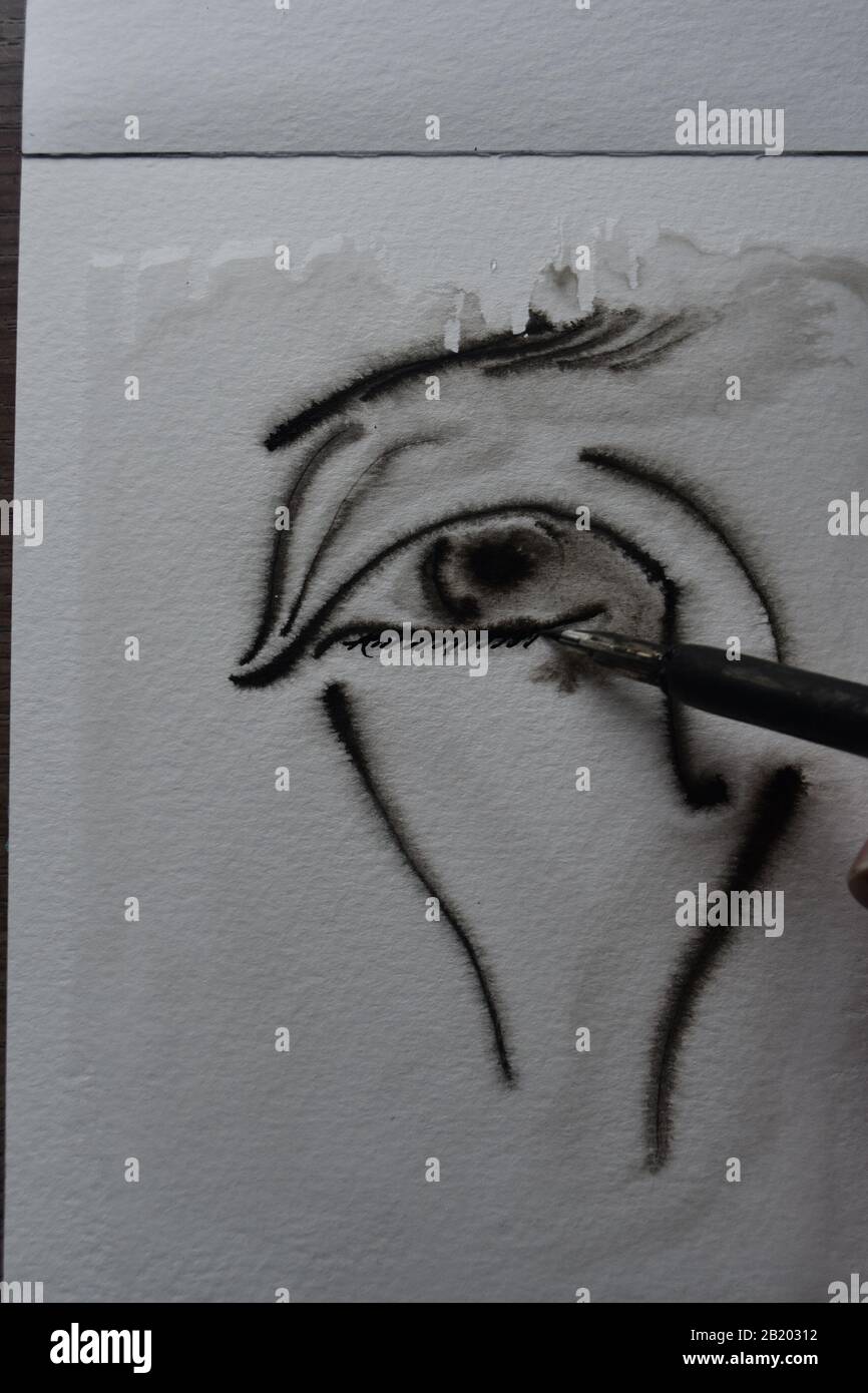 Sequence of drawing with dip pen in India ink onto wet watercolour ...