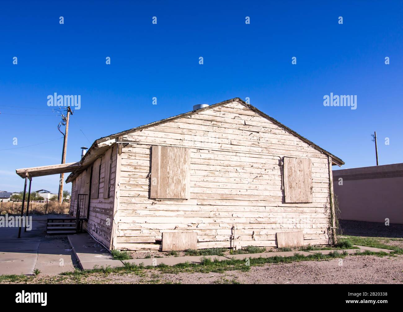 Abandoned Building With Boarded Up Windows Stock Photo - Alamy