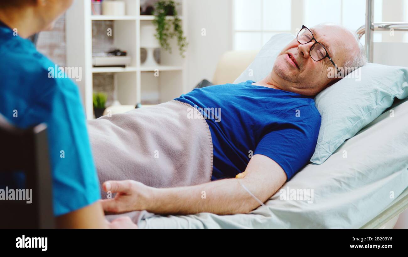 Old person and hospital bed sitting up hi-res stock photography and ...