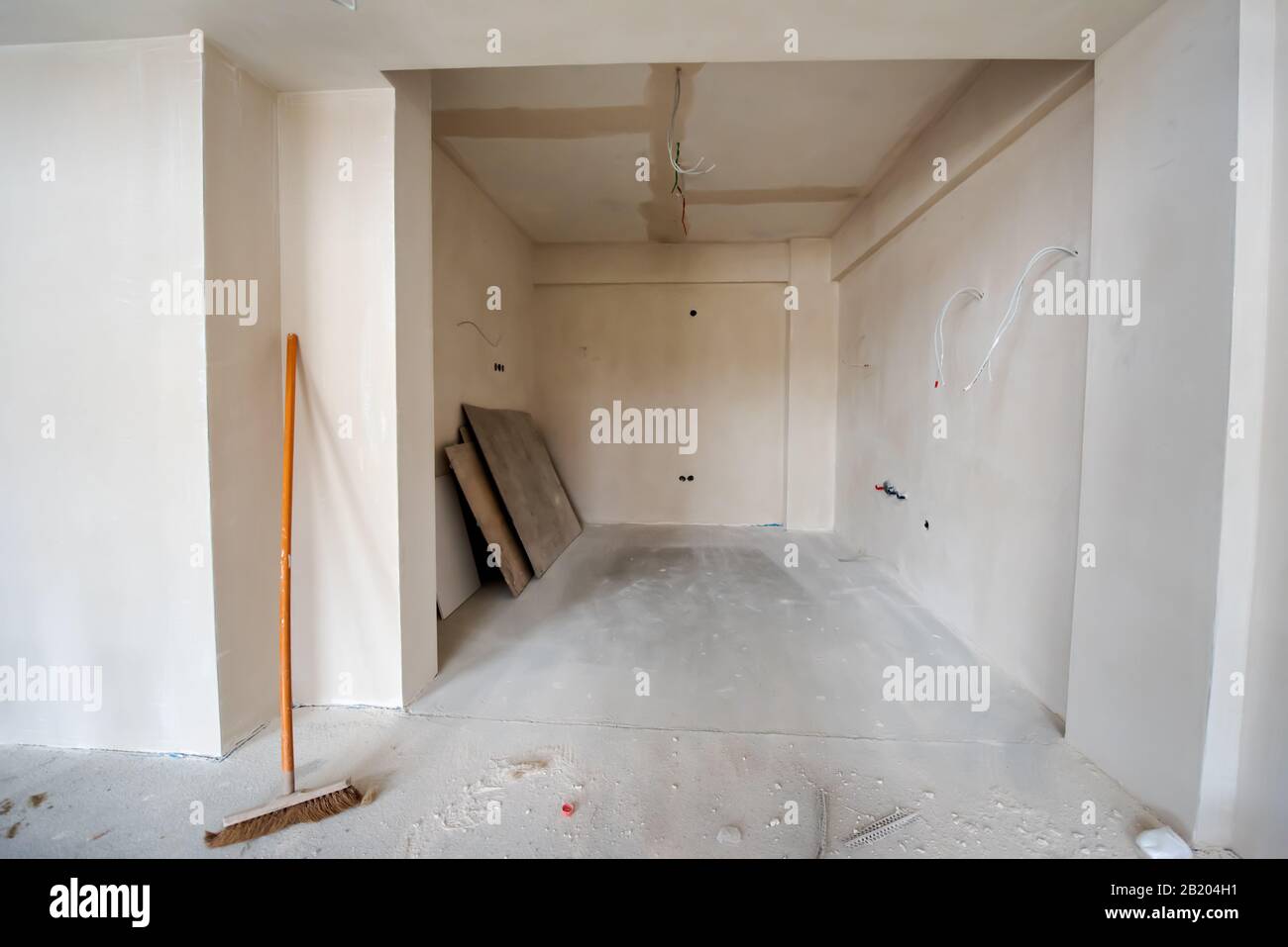 interior of construction site with drywall completely installed at new ...