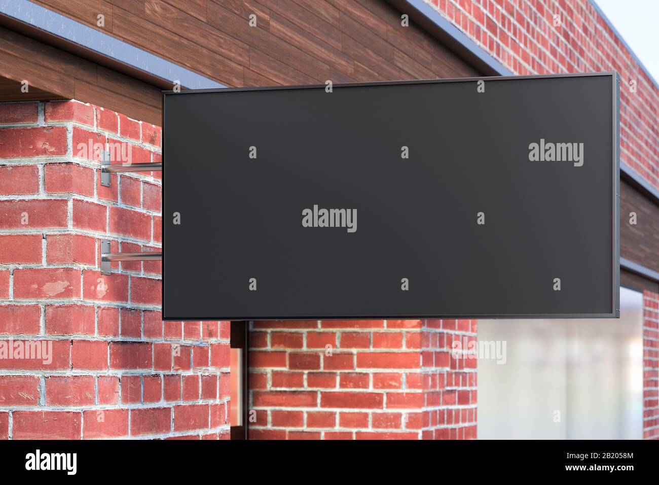 Horizontal singboard or signage on the red brick wall with blank black ...