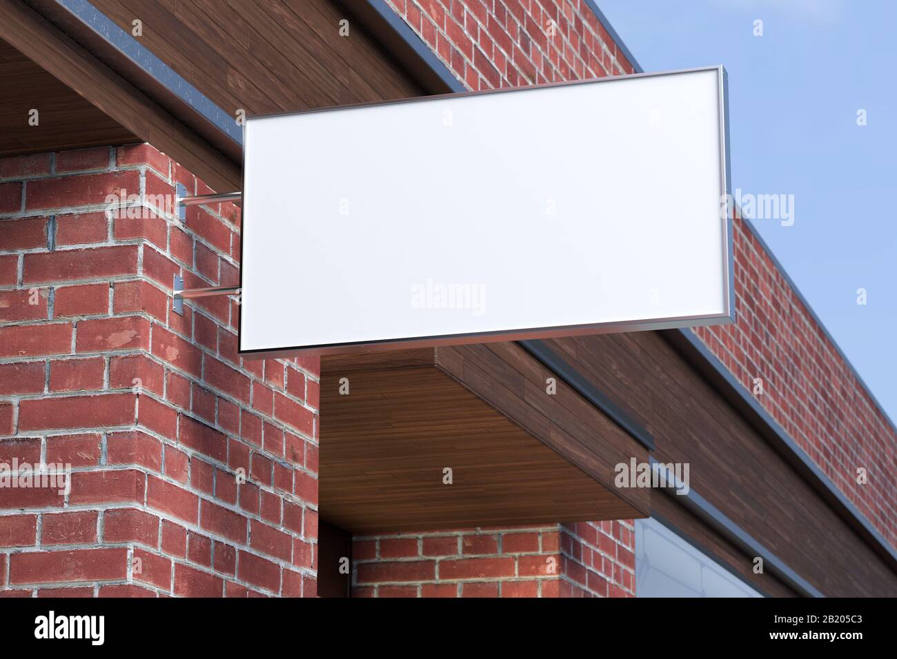 Horizontal singboard or signage on the red brick wall with blank white ...