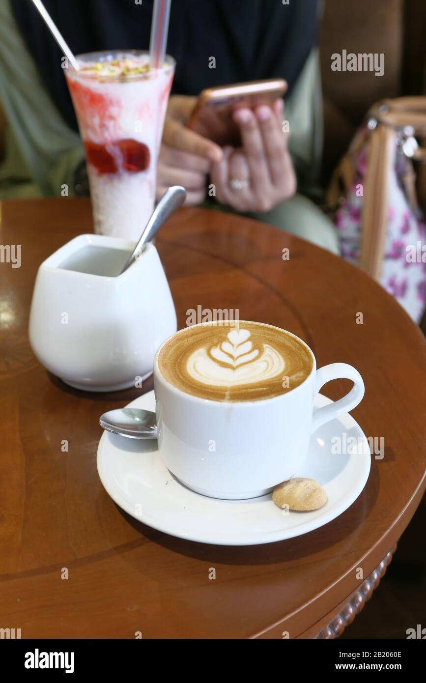 close up of late coffee and food on cafe table Stock Photo - Alamy