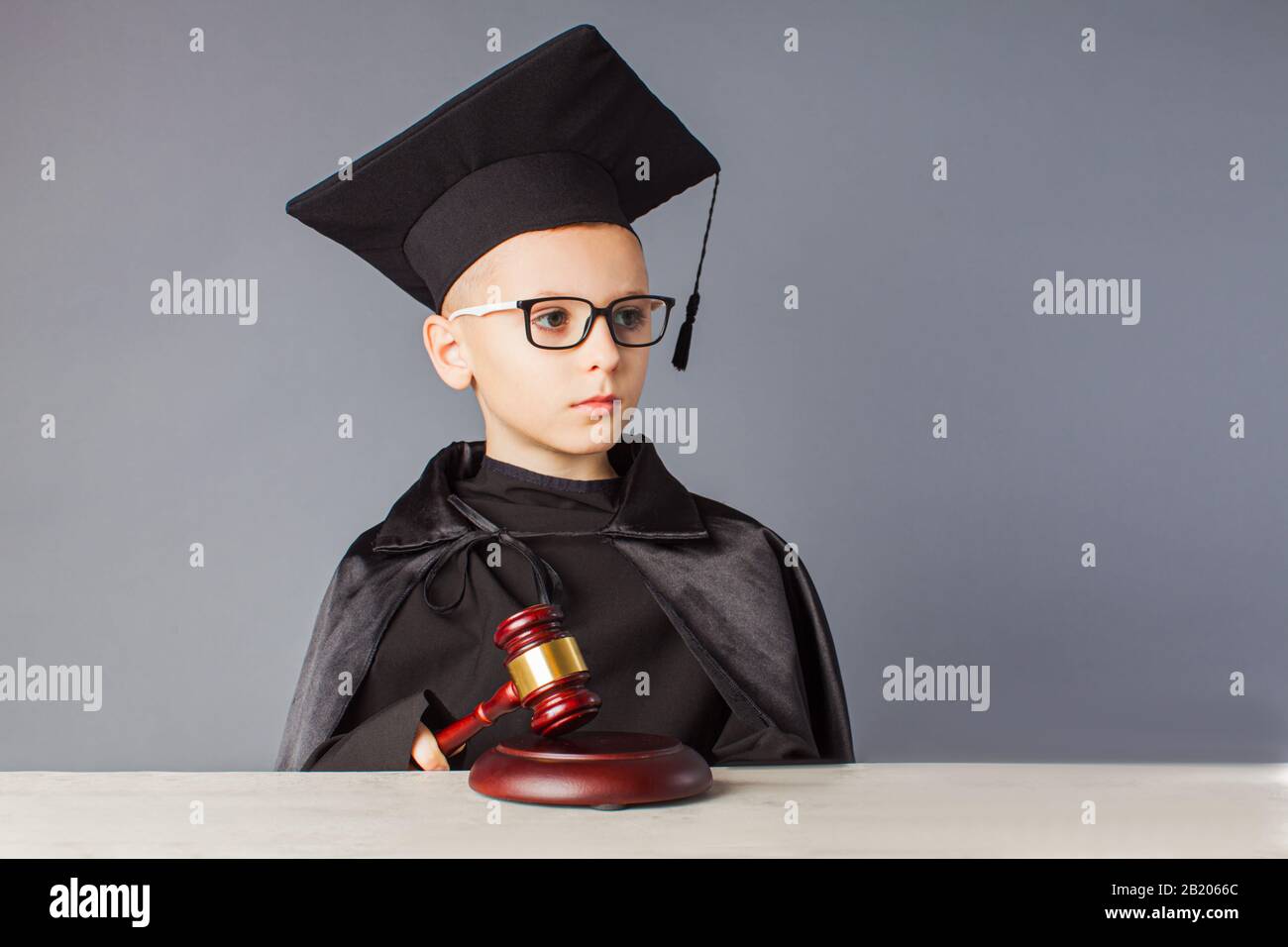 Portrait of serious boy judge makes a decision. Future profession Stock ...