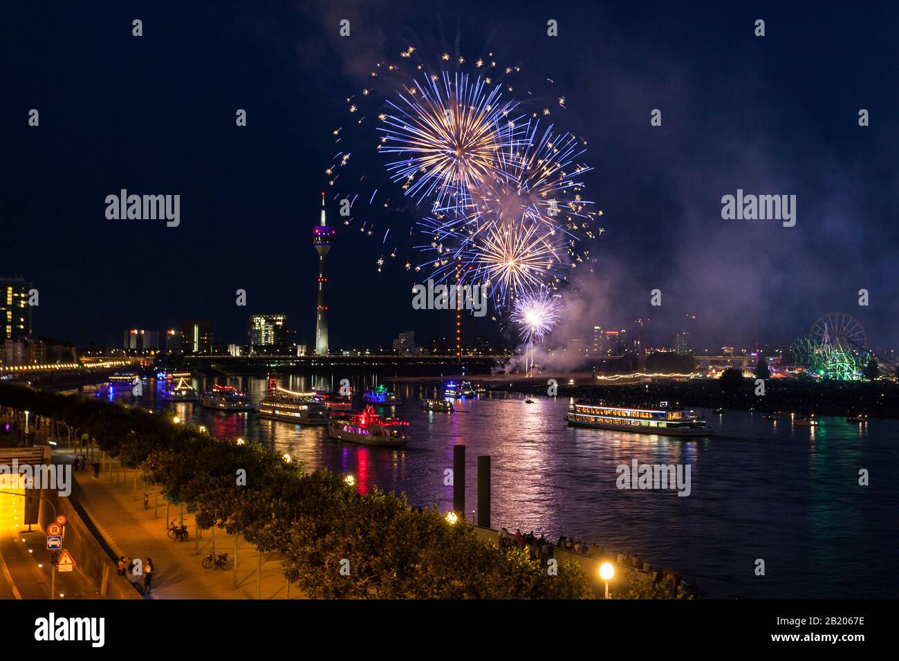 A gigantic firework display always takes place at the largest fun fair ...
