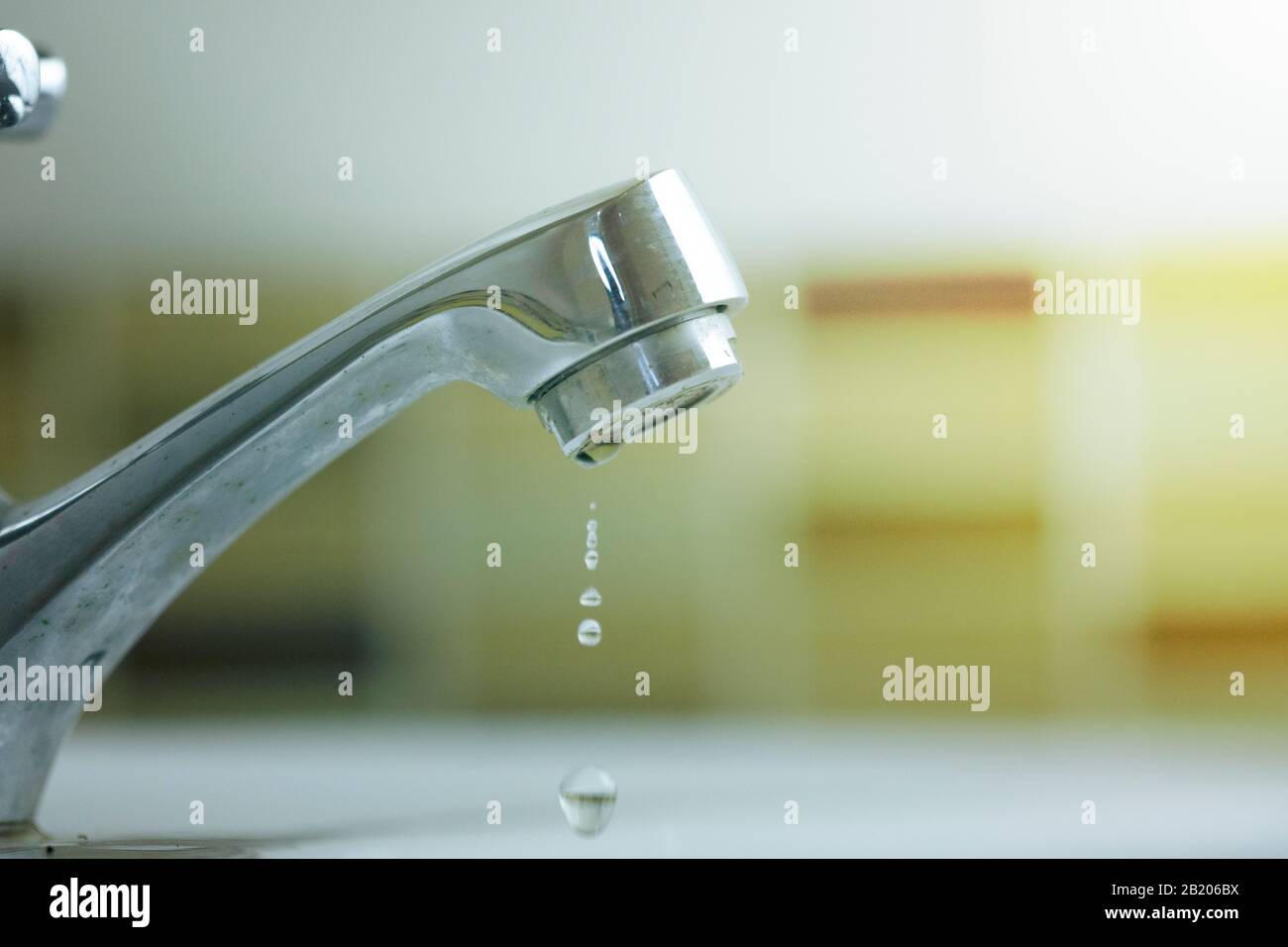 water tap with dripping waterdrop. Water leaking, saving concept Stock ...