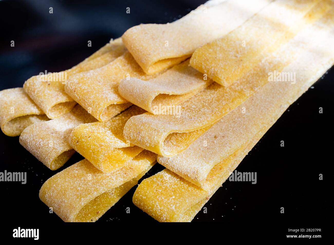 Close up of hand made Italian tagliatelle fresh pasta Stock Photo - Alamy