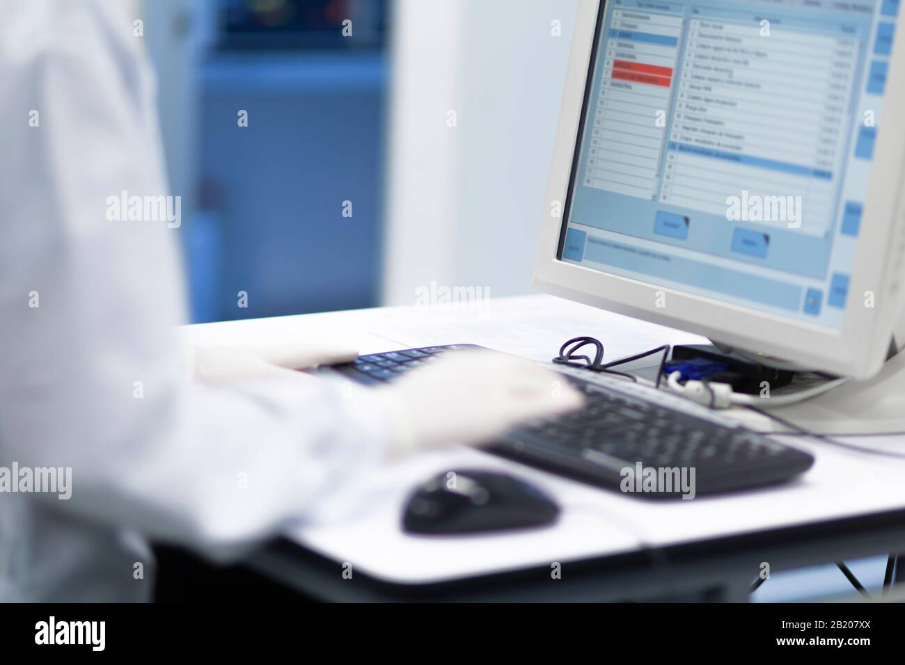 Female Nurse Working on Laptop Computer In Lab Stock Photo - Alamy