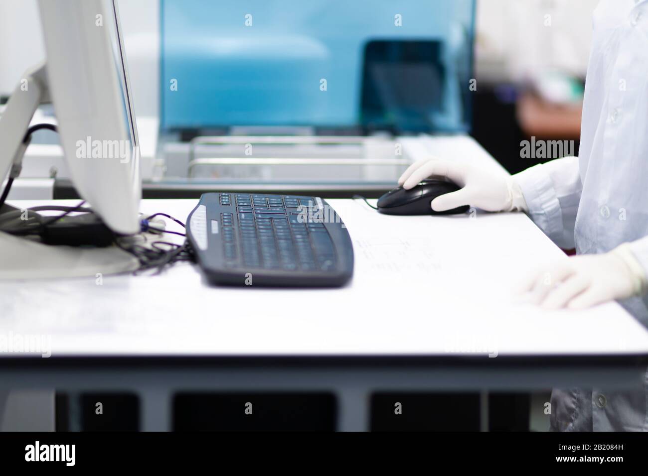 Female Nurse Working on Laptop Computer In Lab Stock Photo - Alamy