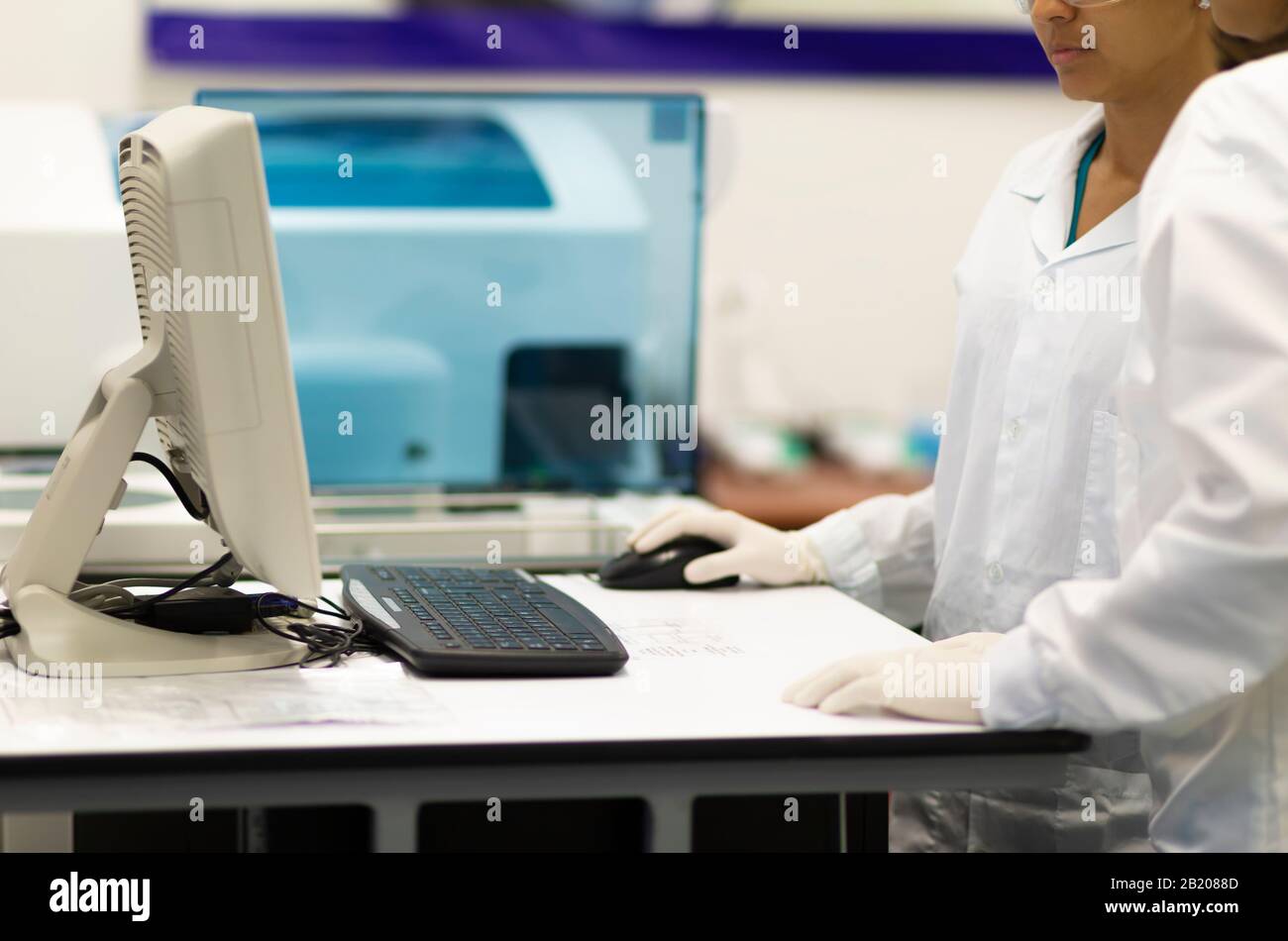 Female Nurse Working on Laptop Computer In Lab Stock Photo - Alamy