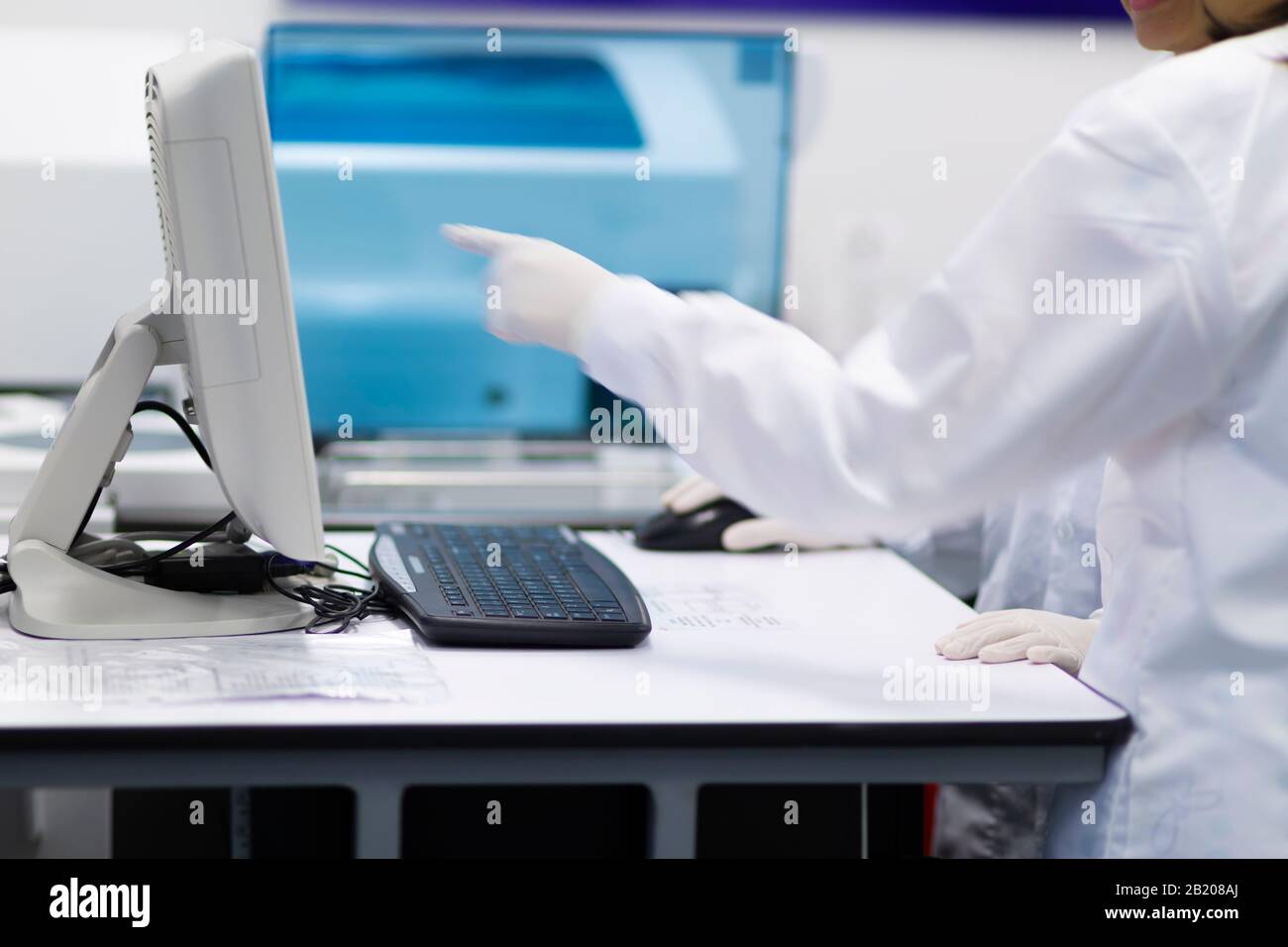 Female Nurse Working on Laptop Computer In Lab Stock Photo - Alamy